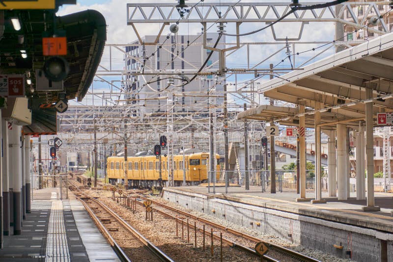 Yellow Train Entering the Train Stock Photo - Image of peron, yellow ...