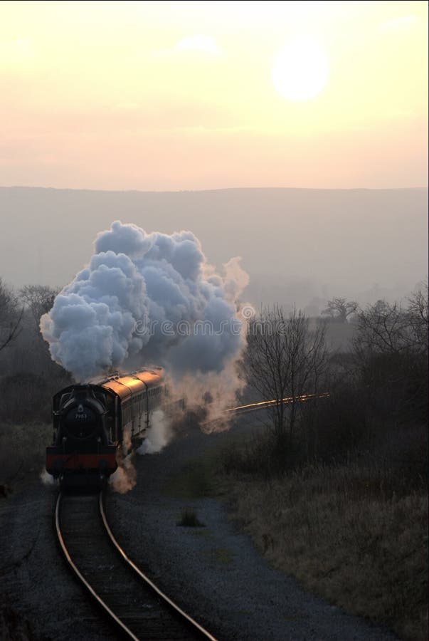 Train at sunset stock photo. Image of railroad, rail - 12625640