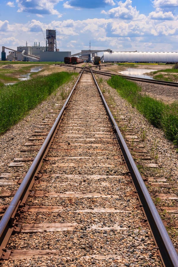 A Train Track with a Train in the Distance Stock Image - Image of ...