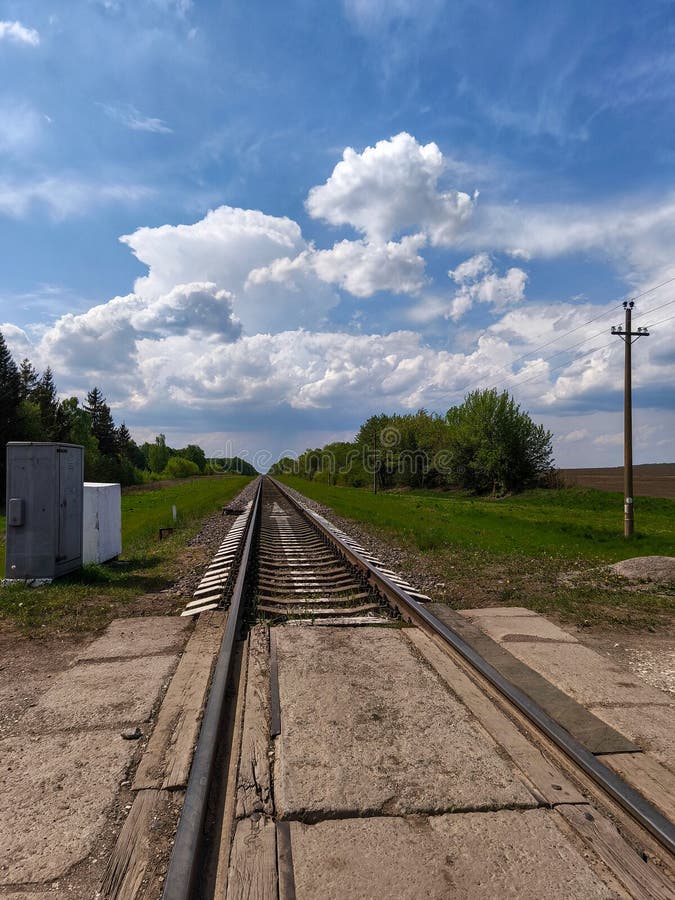 A Train Track in the Middle of a Grassy Field Stock Image - Image of ...