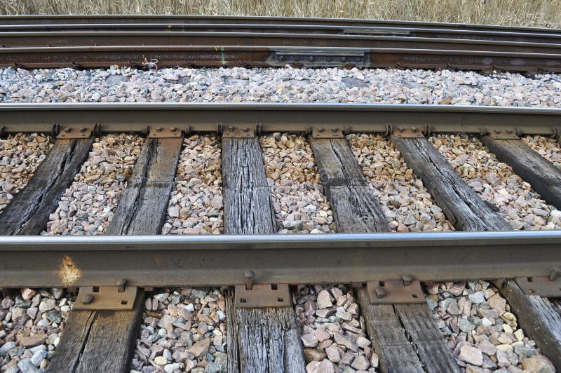 Train Track with Railroad Ties and Large Rocks. Stock Photo - Image of ...