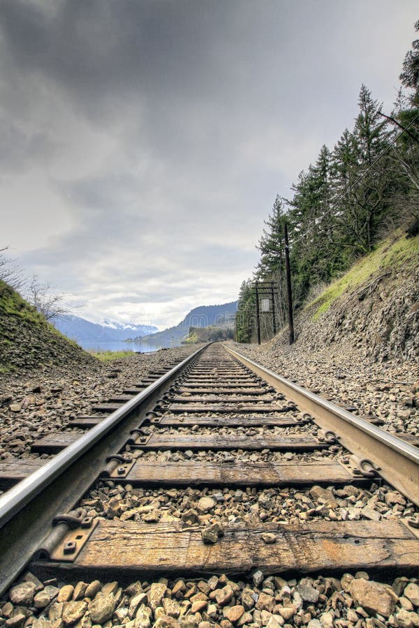 Railroad Tracks Along the River Stock Photo - Image of ledges, tracks ...