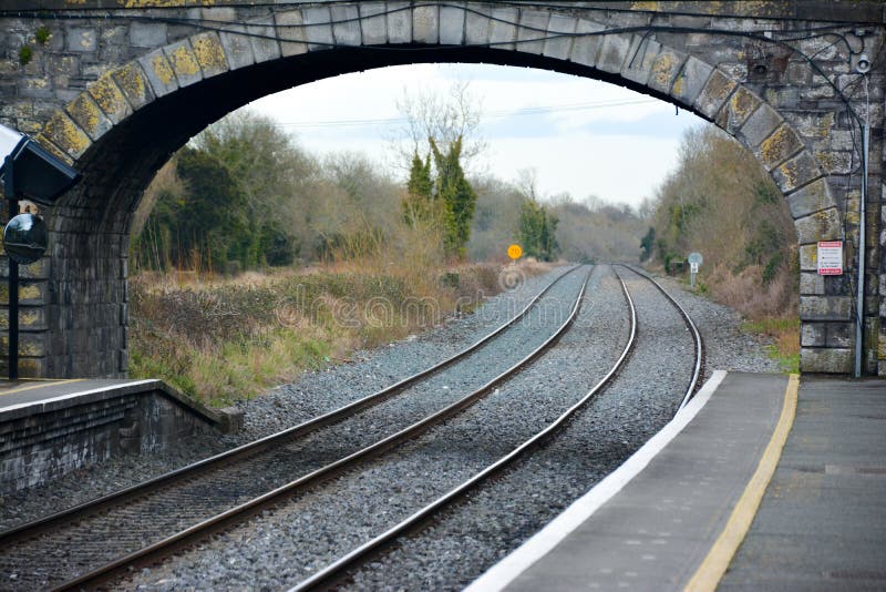Train Tracks Going Under Old Stone Bridge Stock Photo - Image of ...