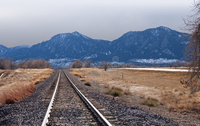 Train Tracks Head Towards Stormy Mountains Stock Photo - Image of ...