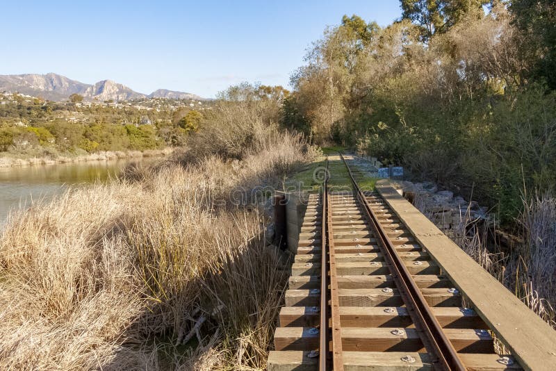 Train Tracks with Lake and Trees Stock Image - Image of scenic, bridge ...
