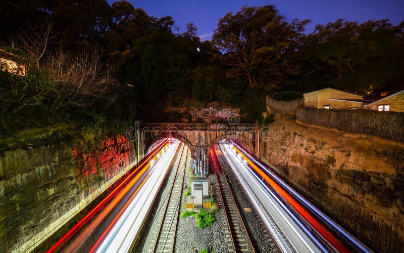 Train Tracks at Night Illuminated by Light Trails. Stock Photo - Image ...