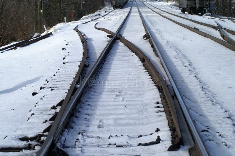 Train tracks in the snow stock photo. Image of railway - 75874552