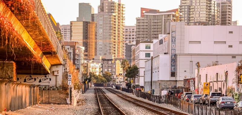 Train Tracks at Sunset Leading into a City Editorial Stock Photo ...