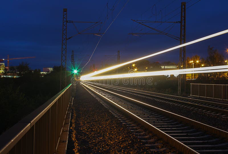 Train Trails in Night on Long Exposure with Green Light Stock Image ...