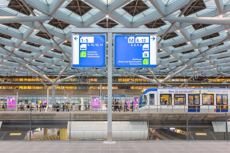 Train and Tram Information Sign on a Two Level Station Platform Inside ...