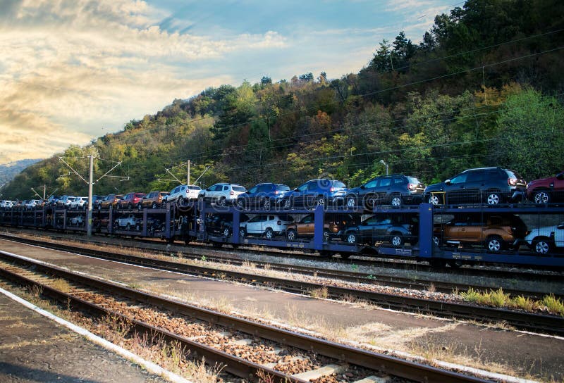 Train Transporting Cars.Autorack with New Cars for Export Editorial ...