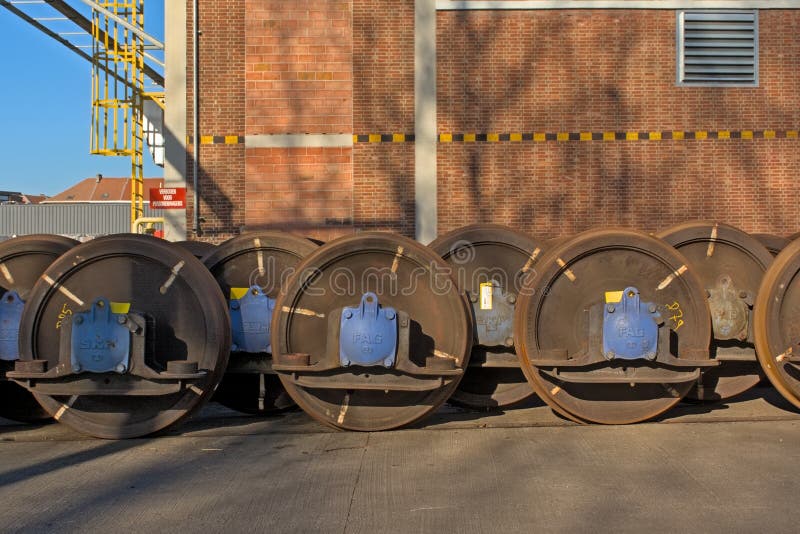 Train Wheel Sets in Front of an Industrial Building Editorial Stock ...