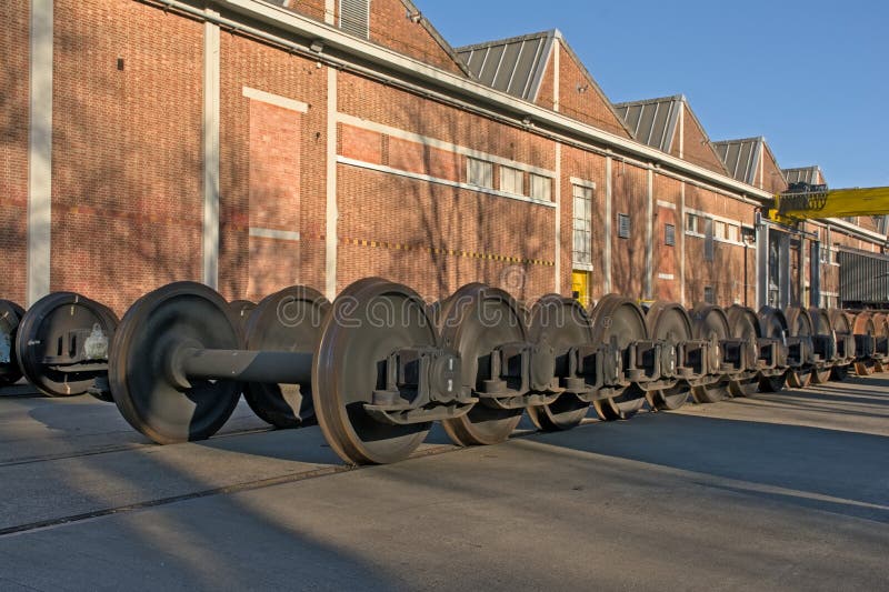 Train Wheel Sets in Front of an Industrial Building Editorial Photo ...