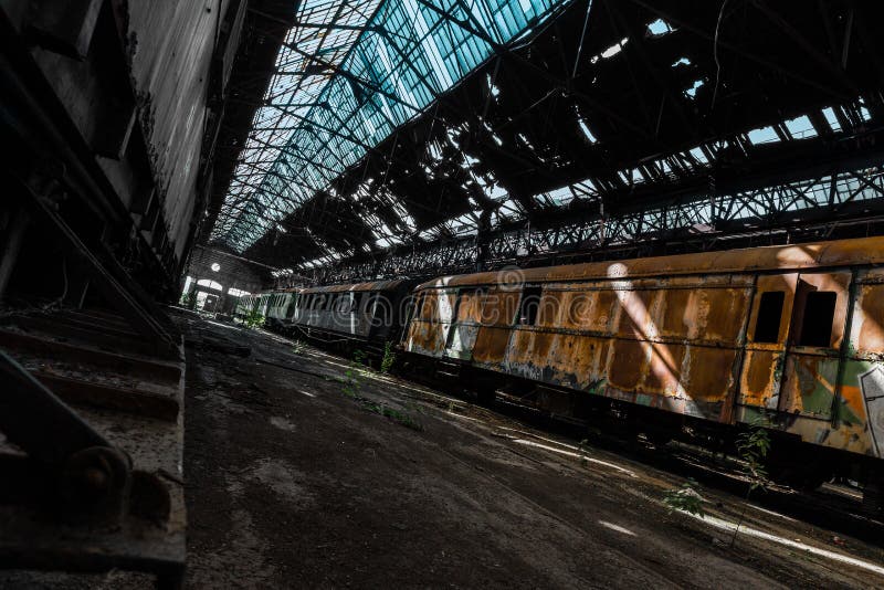 Train Wreck in an Abandoned Warehouse Stock Photo - Image of parking ...