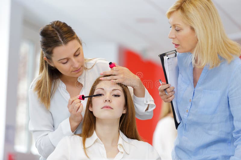 Trainee Beautician Applying Cosmetics Under Supervision in Salon Stock ...