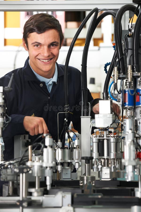 Trainee Engineer Working on Machinery in Factory Stock Image - Image of ...