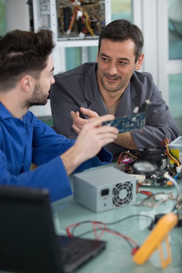 Trainee Technician Learning How To Wire Up Computer Stock Image - Image ...