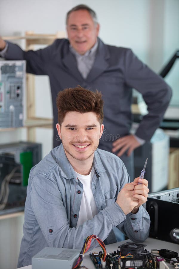 Trainee Technician Learning How To Wire Up Computer Stock Image - Image ...