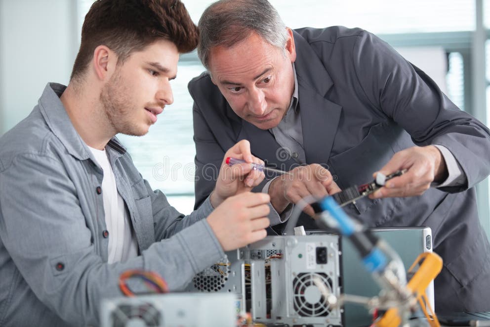 Trainee Technician Learning How To Wire Up Computer Stock Photo - Image ...
