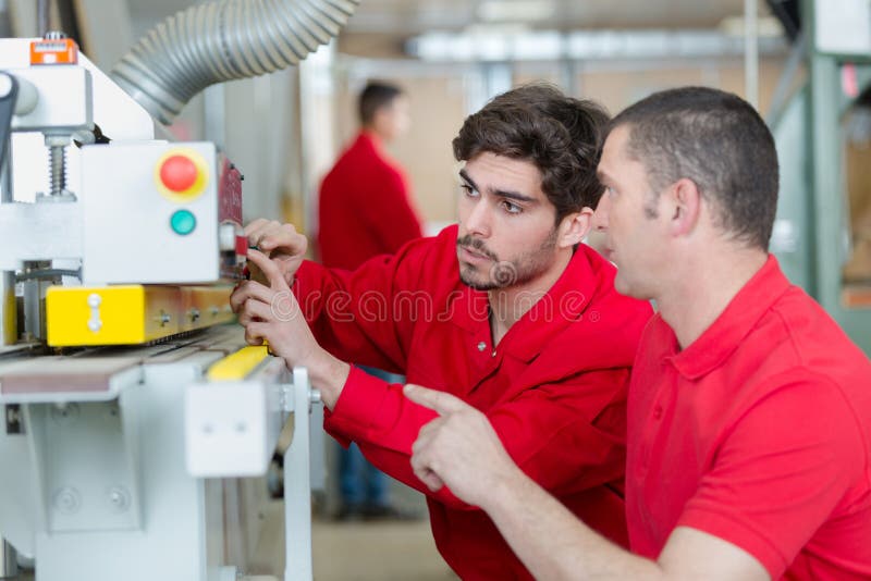 Trainee Worker Asking Foreman about Machinery Controls Stock Photo ...