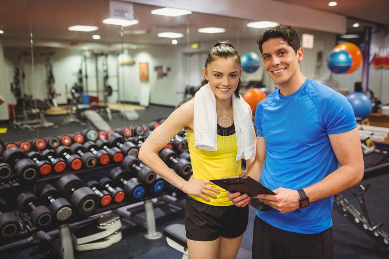 Trainer and Client Discussing Her Progress Stock Image - Image of ...