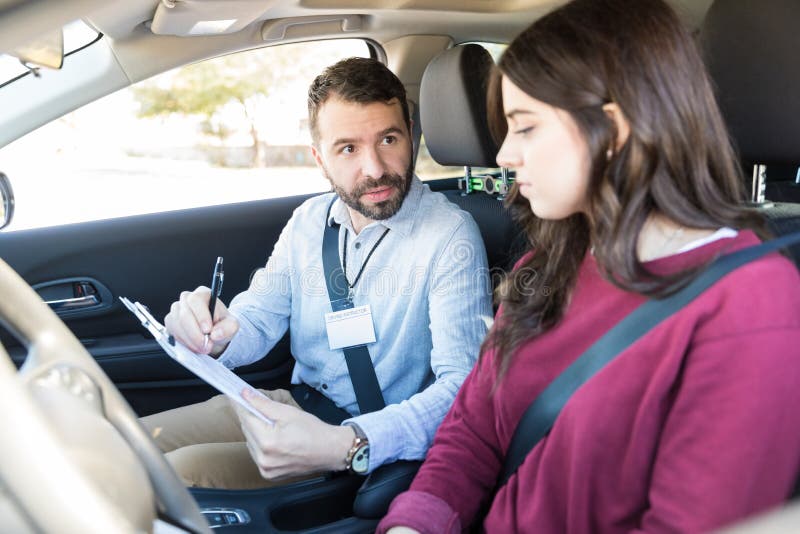 Trainer Explaining Checklist To New Car Driver Stock Photo - Image of ...