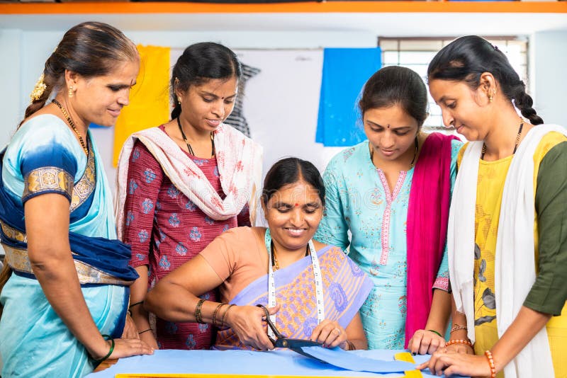Trainer Explaining or Guiding To Cut Clothes To Group of Women Students ...