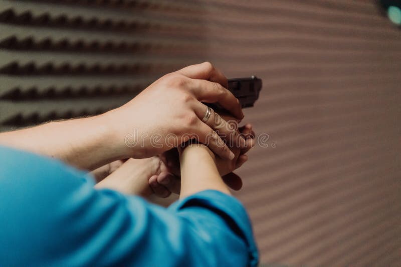 The Trainer Explaining To the Man How To Use the Gun. Training in the ...