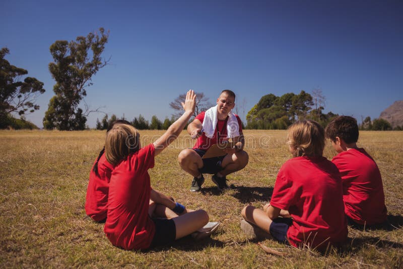 Trainer Instructing Kids in the Boot Camp Stock Photo - Image of ...