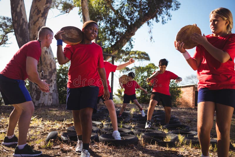 Trainer Instructing Kids during Obstacle Course Training Stock Image ...