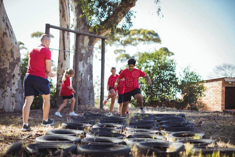 Trainer Instructing Kids during Obstacle Course Training Stock Image ...
