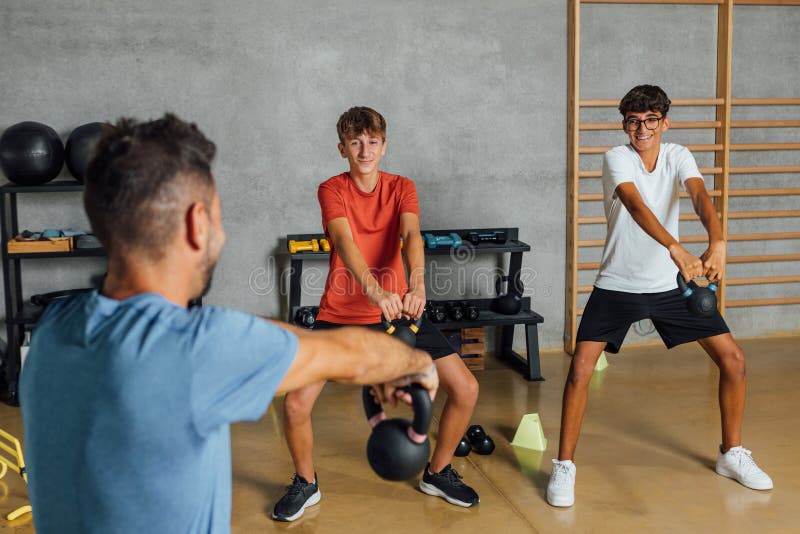 Trainer Instructor Shows Dumbbell Weight Lifting Exercises Stock Photo ...