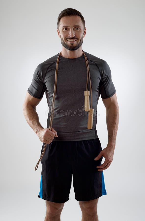 Trainer with jump rope stock image. Image of health, cheerful - 64994059