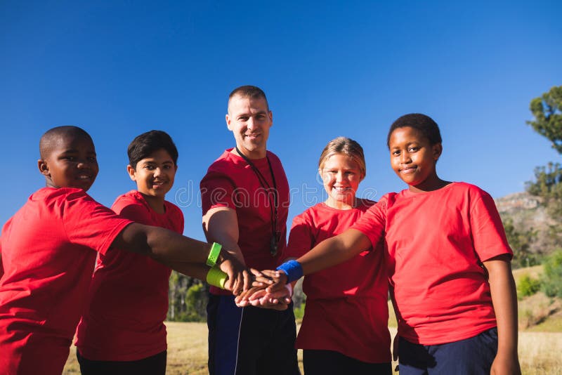 Trainer and Kids Forming Hand Stack in the Boot Camp Stock Image ...