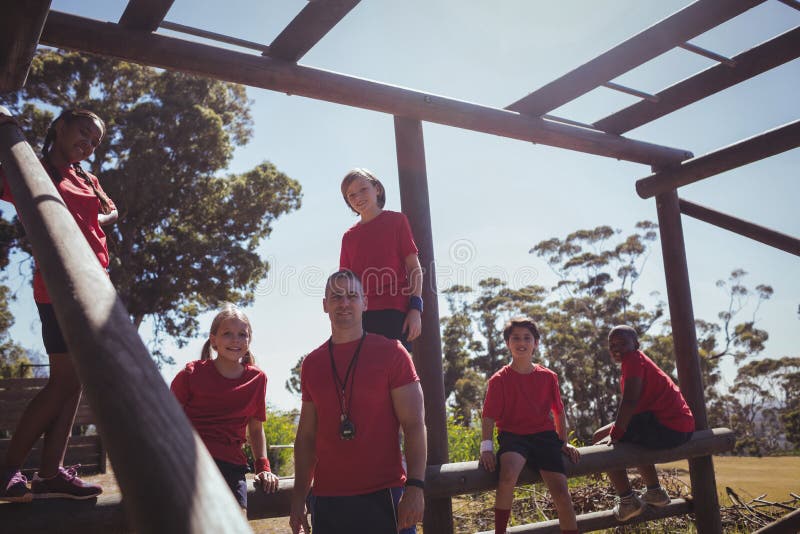 Trainer and Kids Relaxing in the Boot Camp Stock Photo - Image of ...