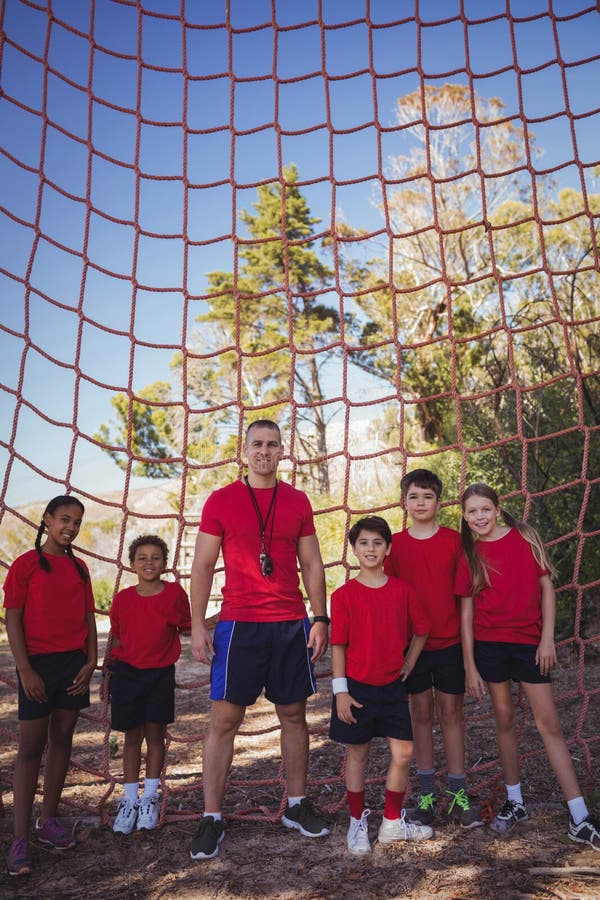 Trainer and Kids Standing Together in the Boot Camp Stock Photo - Image ...