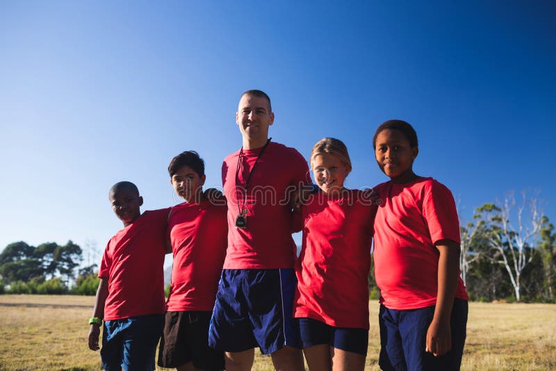 Trainer and Kids Standing Together in the Boot Camp Stock Photo - Image ...