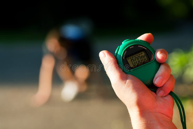 Trainer Measuring Time of Sprinter Stock Photo - Image of summer ...