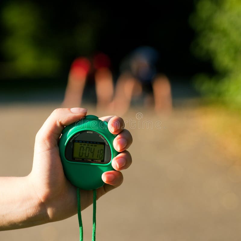 Trainer Measuring Time of Two Sprinters Stock Photo - Image of active ...