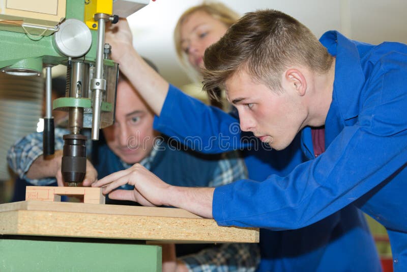 Trainer Observing Woodworking Apprentice Drilling Board Stock Image ...