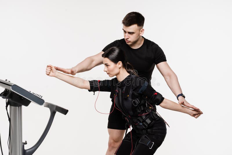Trainer Shows an Example of the Exercise Using EMS Electrical Muscle ...