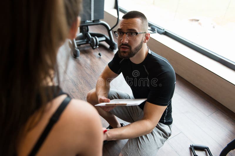 Trainer Takes Notes while Woman Sitting and Resting Stock Image - Image ...