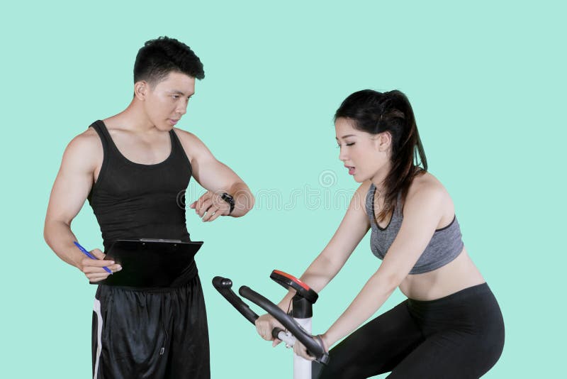 Trainer Timing His Client during Exercise on Studio Stock Image - Image ...