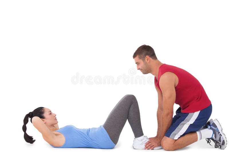 Trainer with Woman Doing Sit Ups Stock Image - Image of cheerful ...