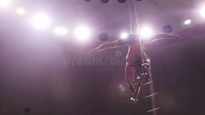 Training in Circus - a Man Standing Upside Down without Hands and Legs ...