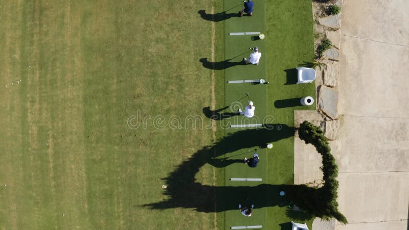Aerial View of a Row of People Training on the Golf Course. Practice ...