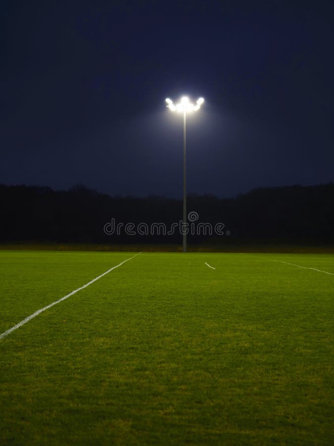 Training Ground with Grass Illuminated by Modern Powerful LED Lights ...