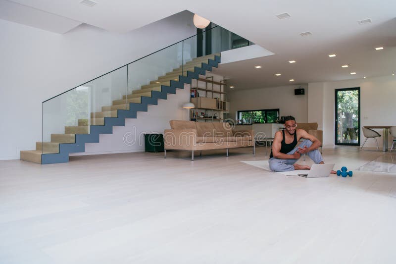 Training at Home. Sporty African American Man Doing the Training while ...