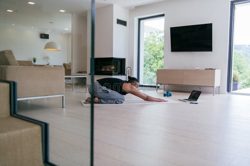 Training at Home. Sporty African American Man Doing the Training while ...