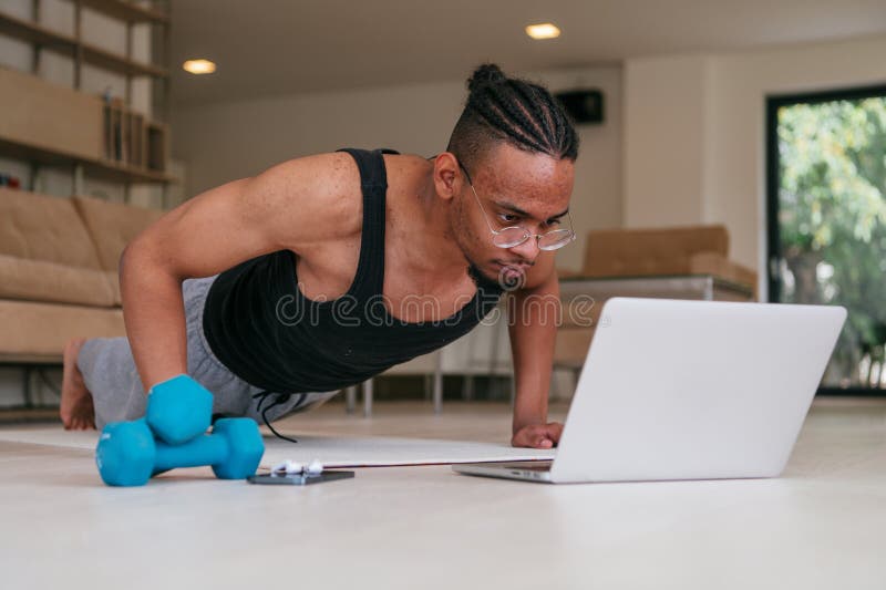 Training at Home. Sporty African American Man Doing the Training while ...